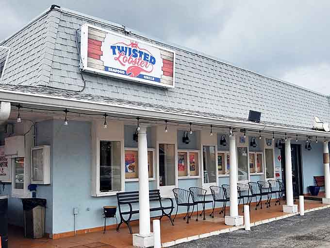 The unassuming exterior of The Twisted Lobster belies the culinary treasures within. Blue walls and a simple sign invite curious food lovers to discover what locals already know.