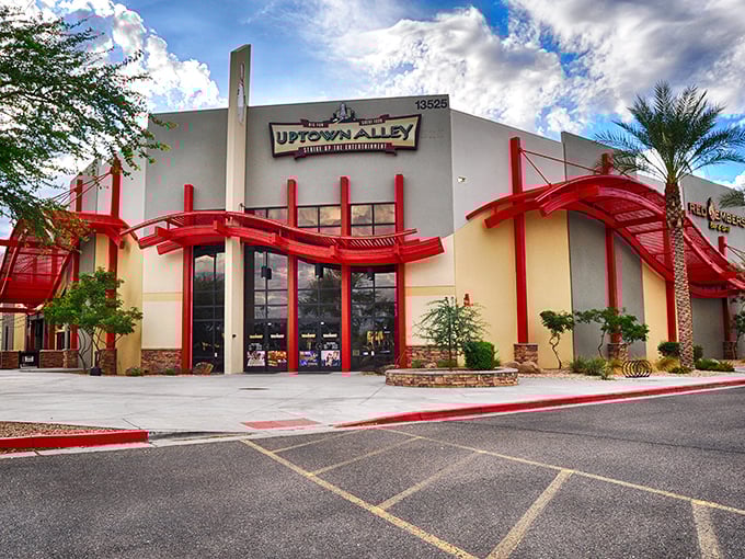 Uptown Alley's striking exterior with bold red architectural elements promises an adventure before you even step inside. Entertainment with exclamation points!