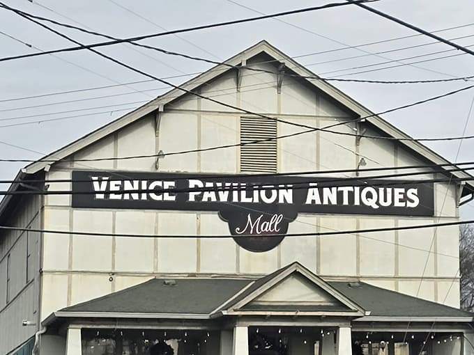 The stately white exterior of Venice Pavilion Antiques stands like a beacon for treasure hunters, promising three floors of nostalgic discoveries inside.
