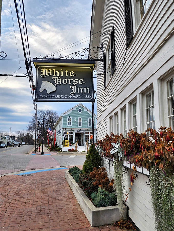 The iconic White Horse Inn sign welcomes visitors to this historic Metamora landmark, where culinary traditions meet modern comfort.