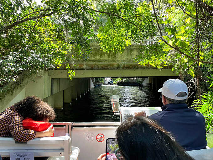 Gliding under moss-draped bridges, the Winter Park Scenic Boat Tour offers a glimpse into Florida's secret waterways where time seems to slow with each ripple.