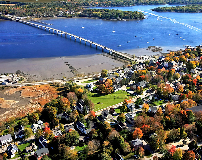 Wiscasset's stunning aerial view showcases the iconic bridge spanning the Sheepscot River &ndash; Maine's postcard-perfect village living up to its reputation.