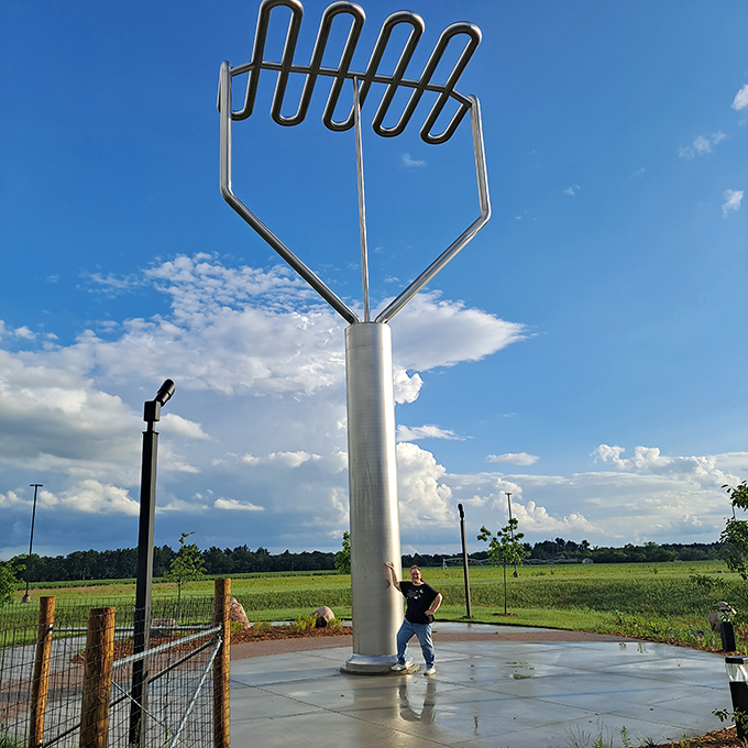 Standing tall against blue skies, this 39-foot kitchen tool proves Wisconsin doesn't mess around when it comes to mashed potato preparation.