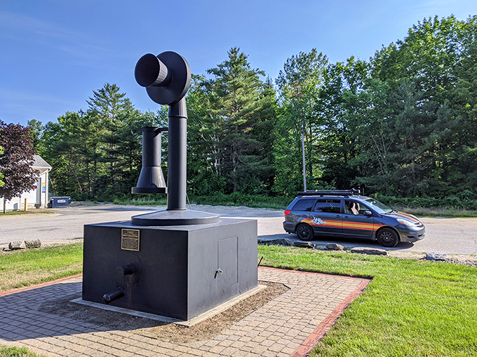The World's Largest Telephone stands tall against Maine's blue sky, a monument to communication that would make Alexander Graham Bell do a double-take.