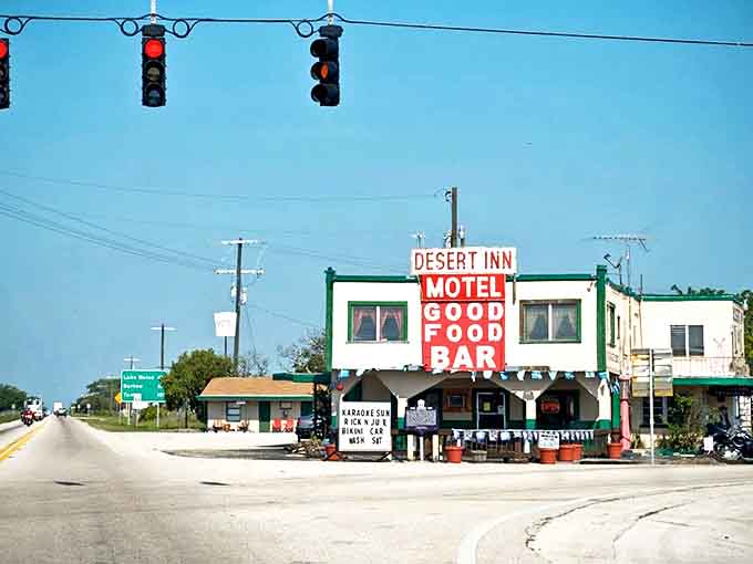 The iconic Desert Inn Motel stands proudly at Yeehaw Junction's crossroads, its vintage sign a beacon for road-weary travelers seeking authentic Old Florida charm.