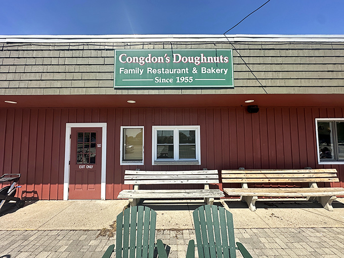 The iconic red exterior of Congdon's Doughnuts welcomes hungry visitors with its nostalgic charm and promise of delicious treasures within.