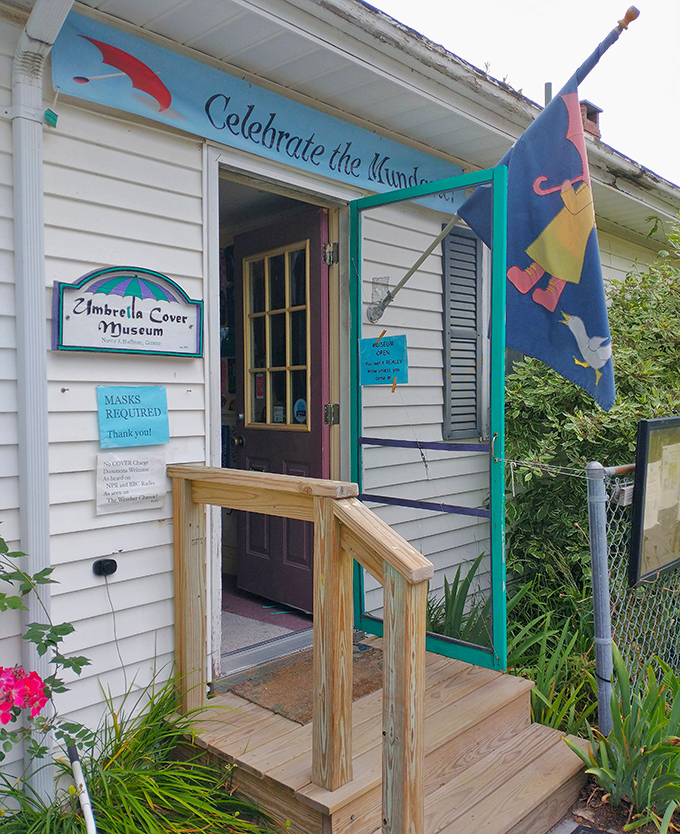 The charming exterior of the Umbrella Cover Museum welcomes visitors with whimsical flags and colorful trim, promising quirky delights within.