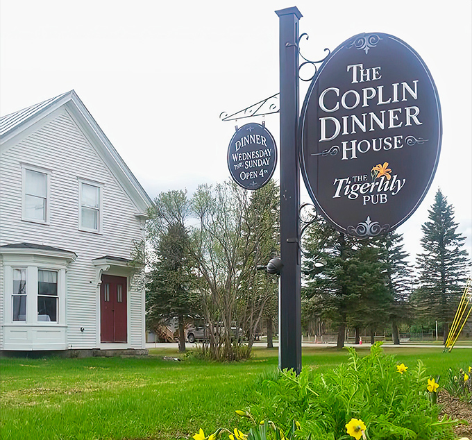 The classic New England charm of The Coplin Dinner House beckons from the roadside, a white clapboard haven for food lovers seeking extraordinary flavors.