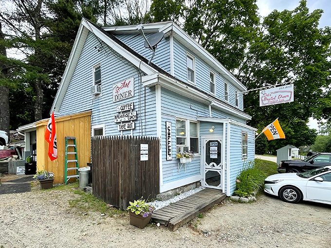 The sky-blue clapboard exterior of Deb's Bristol Diner stands like a humble beacon of breakfast hope on a quiet Maine road.