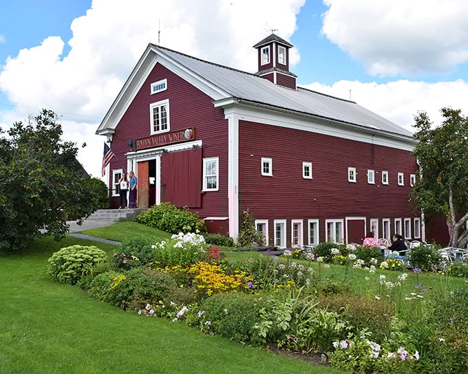 The iconic crimson barn of Boyden Valley Winery stands proudly against Vermont's sky, its classic New England architecture promising treasures within.
