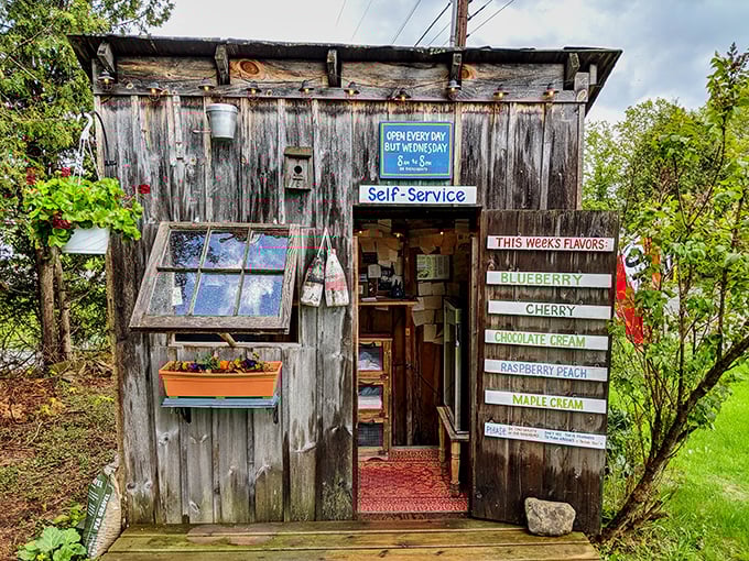 The weathered wooden exterior of Poorhouse Pies looks like something from a storybook, complete with this week's flavors temptingly displayed on handmade signs.