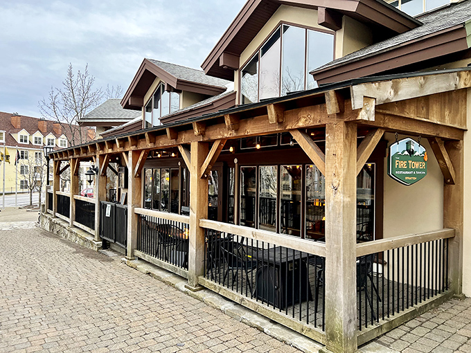 The rustic timber-framed exterior of Fire Tower Restaurant & Tavern welcomes visitors with Vermont mountain charm and unpretentious elegance.