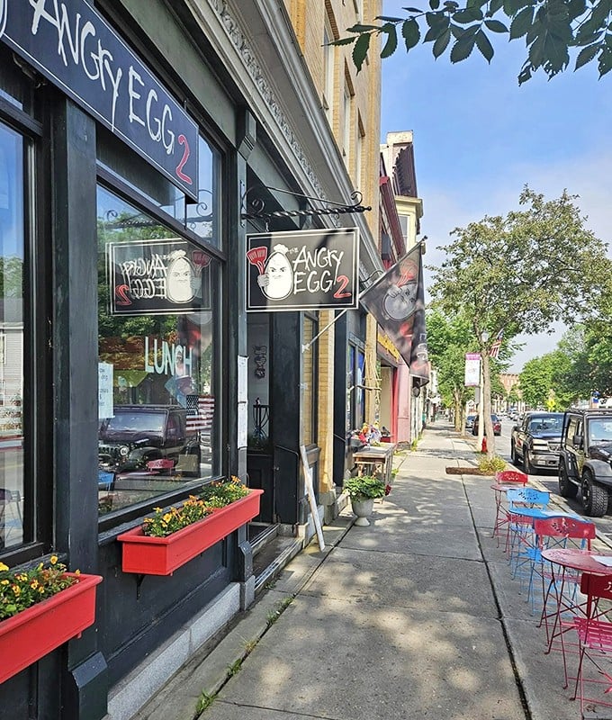 The storefront of Angry Egg 2 beckons with its no-nonsense black exterior and bright red flower boxes &ndash; breakfast with attitude awaits inside.