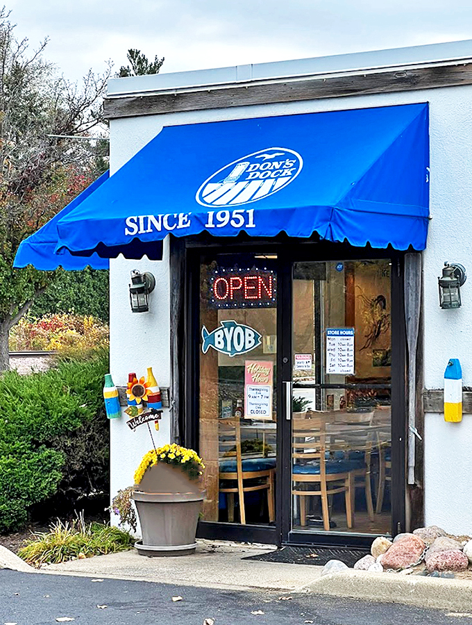 Welcome to seafood paradise! Don's Dock's blue awning beckons like a siren's call, promising oceanic delights since 1951.