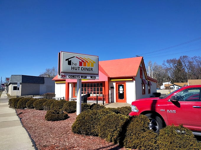 The Hut Diner's vibrant red roof is like a beacon calling all hungry souls home.
