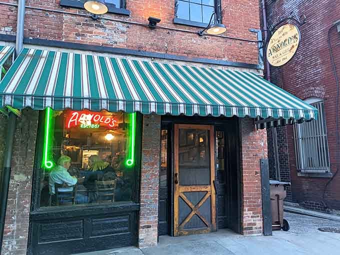 That green-and-white striped awning and glowing neon sign have been welcoming hungry souls since way before Instagram made restaurant exteriors cool.