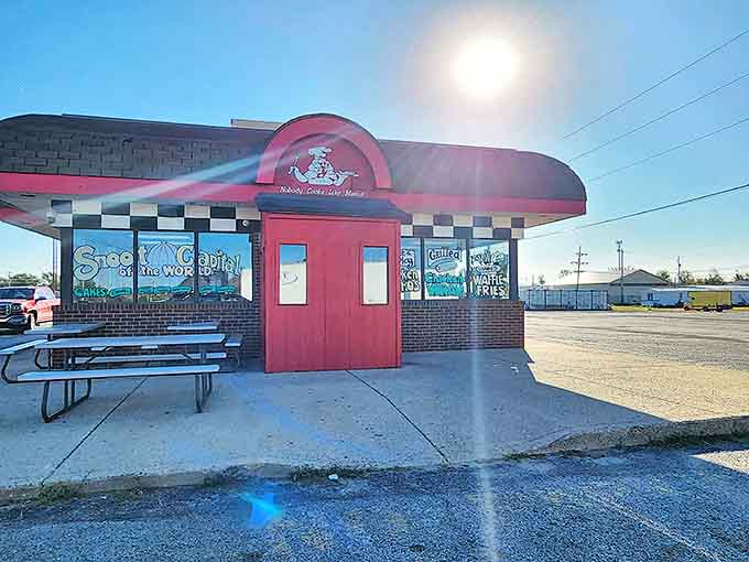 That cheerful red exterior with the checkered trim isn't just cute, it's a beacon calling you toward some of the best comfort food in Illinois.