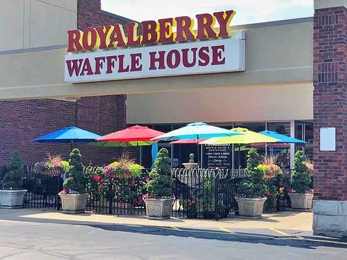 Those rainbow umbrellas aren't just pretty, they're basically saying "happiness is served here, rain or shine, preferably with a side of bacon."