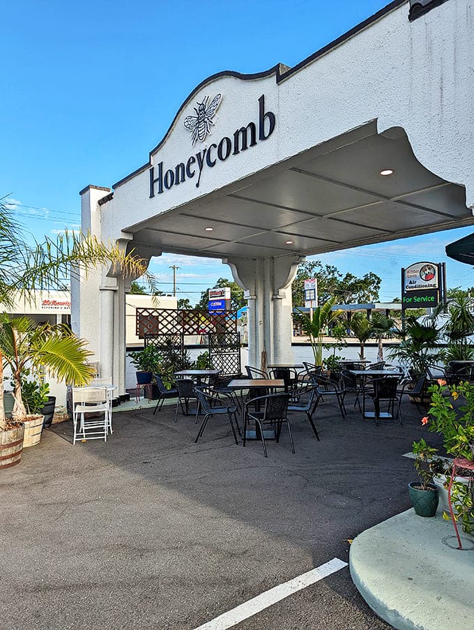 The welcoming facade of Honeycomb Bread Bakers stands like a beacon of carb-happiness in Winter Haven, complete with that adorable bee logo promising sweet things inside.