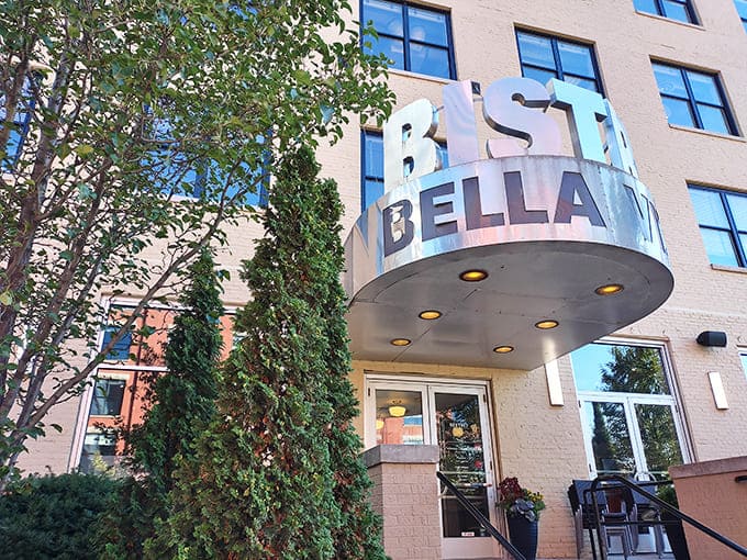 The iconic Bistro Bella Vita sign welcomes hungry souls into a world where European flavors dance with Midwestern hospitality. Grand Rapids' culinary gem awaits!