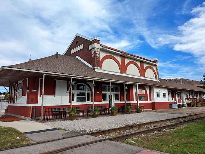 This stunning red and white train station turned cafe looks like it stepped straight out of a Norman Rockwell painting, complete with those gorgeous arched windows.
