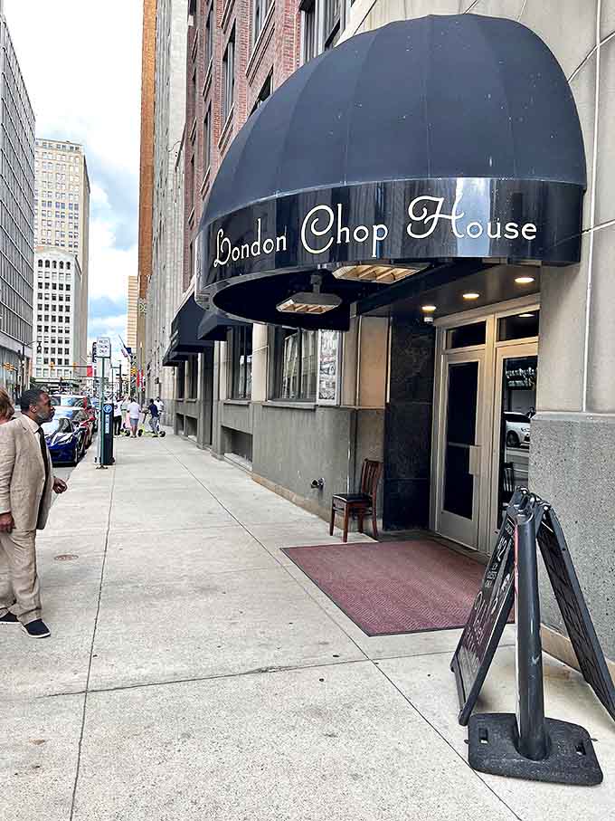 The London Chop House's iconic black awning stands as a beacon of culinary excellence amid Detroit's urban landscape, promising timeless dining experiences behind its elegant doors.