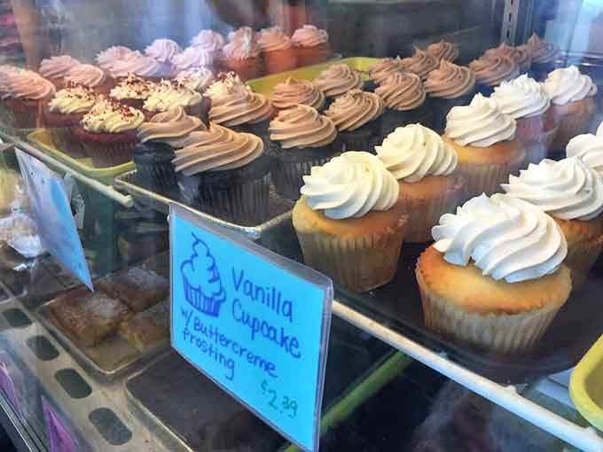 Cupcakes with swirled frosting standing at attention, each one a perfect little celebration waiting to happen in your mouth.