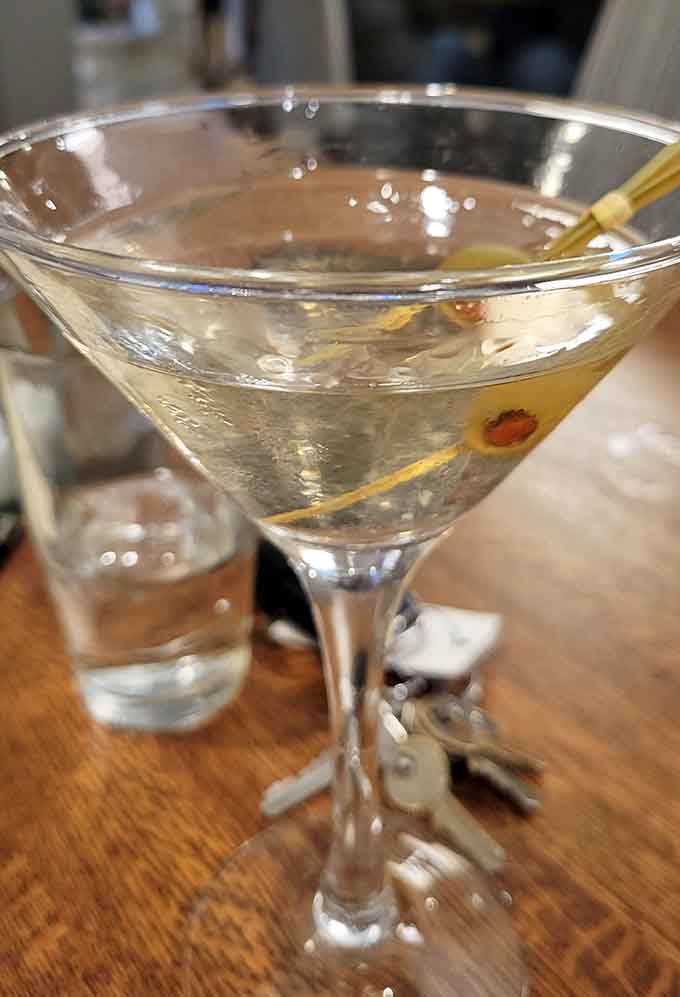 A perfectly chilled martini with olives proves that craft cocktails and small-town taverns aren't mutually exclusive concepts anymore.