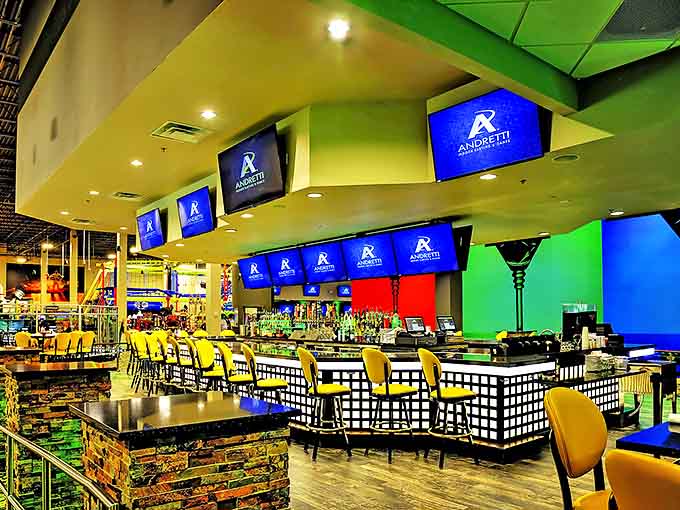The bar area serves craft beers and cocktails for adults who've earned a drink after discovering they're not as naturally talented at racing as they'd assumed.