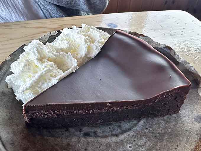 Chocolate cake with a glossy ganache topping provides the sweet ending your meal deserves, rich without being overwhelming or too fancy.