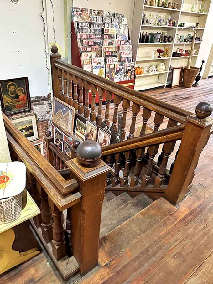 A magnificent wooden staircase leads explorers to new realms of discovery, each step creaking with anticipation of treasures above.