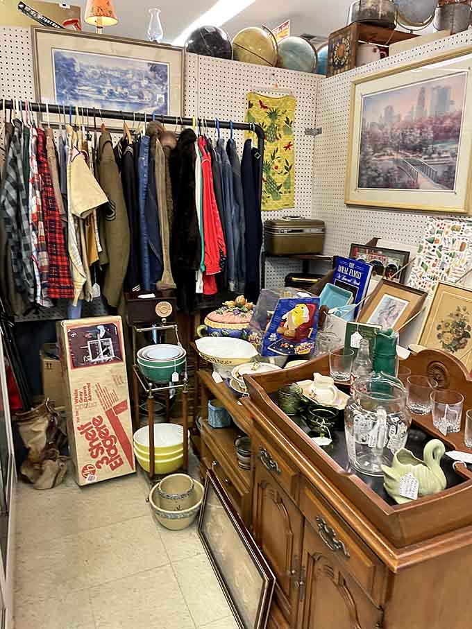 Vintage clothing hangs like guests from different decades, offering a wearable history lesson in American fashion and everyday style evolution.