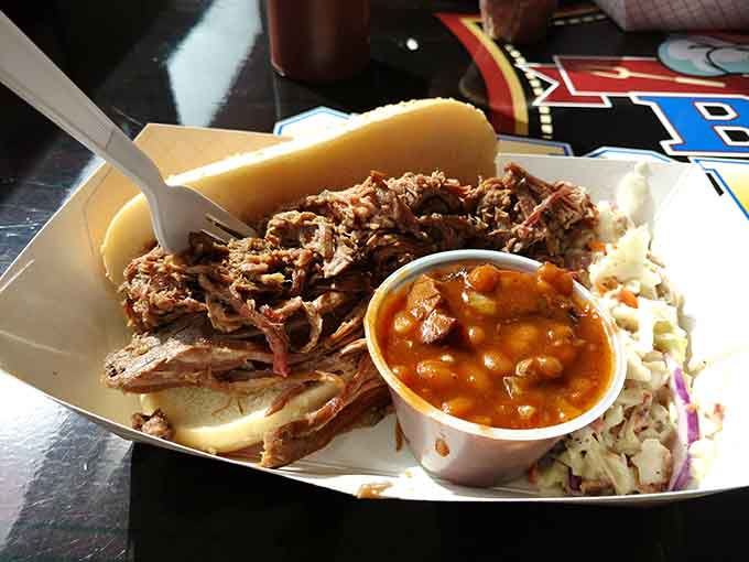 Pulled pork sandwich with all the fixings shows how simple ingredients become something magical when smoke and time work their chemistry together.