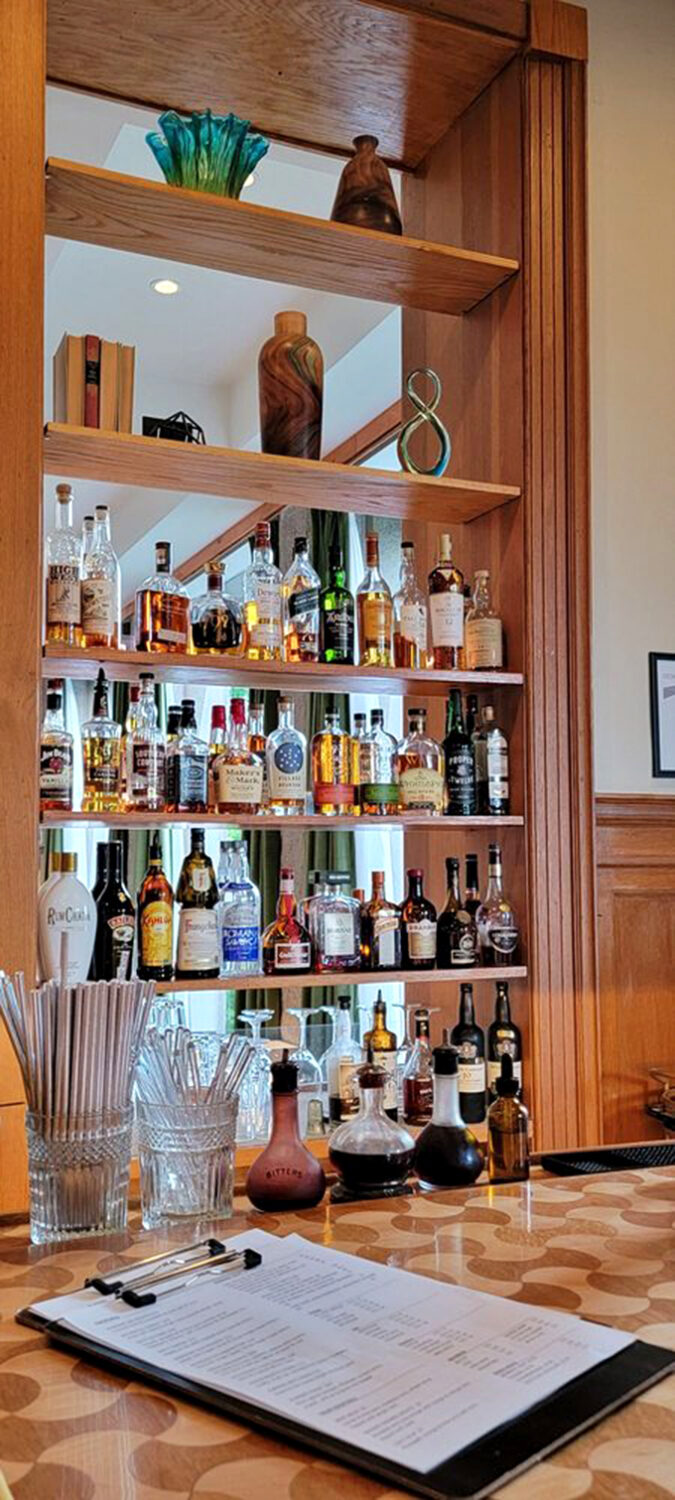 Welcome to cocktail heaven! This bar's got more bottles than a message-in-a-bottle convention.