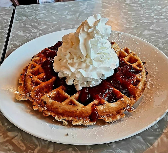 That Belgian waffle topped with syrup and whipped cream represents everything right about breakfast in America, period.