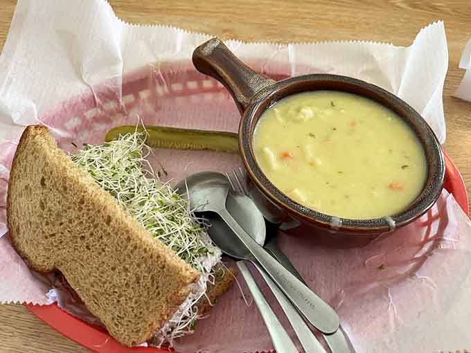 Chicken soup in a proper crock alongside a hearty sandwich proves that comfort food doesn't need to be complicated to be completely satisfying.