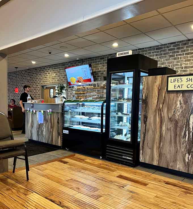 The counter area blends rustic wood elements with modern efficiency, making ordering as pleasant as eating.