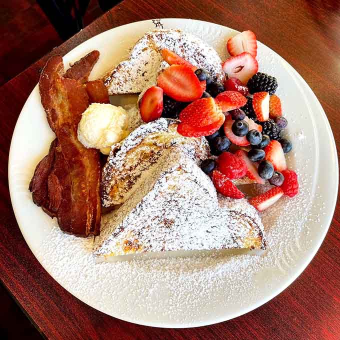 French toast piled high with fresh berries and bacon proves this cafe doesn't do anything halfway or small.