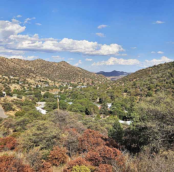 Mountains embrace the town in shades of green and rust, creating a backdrop that changes with the light and reminds you why people chose this spot.