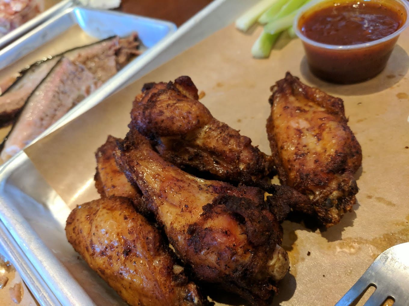 These smoked chicken wings demonstrate Black Dog's mastery of the pit, offering another delicious excuse to order more sweet potato fries.