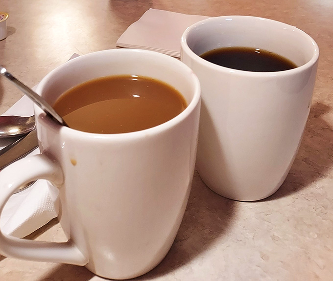 Hot coffee served in proper mugs, because some traditions should never change at a good cafe.