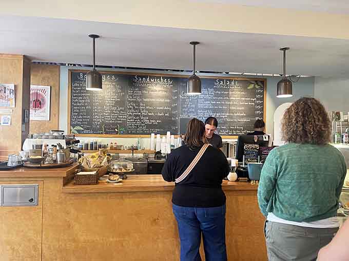 That massive chalkboard menu and welcoming counter setup make ordering feel like part of the experience rather than just a transaction before the good stuff arrives.