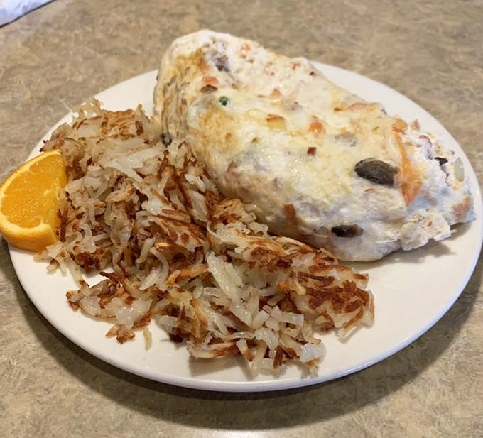 Hash browns achieving that perfect golden-brown crispiness alongside eggs and bacon is basically the breakfast trifecta of happiness.