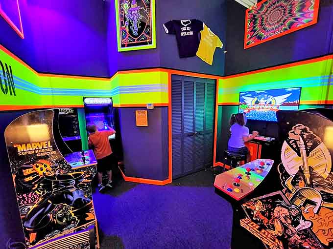The arcade corner lights up with neon nostalgia, offering classic gaming experiences that perfectly complement your comic book adventure.