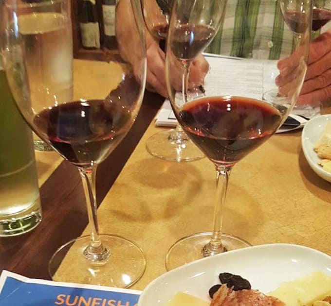 Wine glasses filled with Italian reds and whites prove that good food deserves equally good drinking companions.