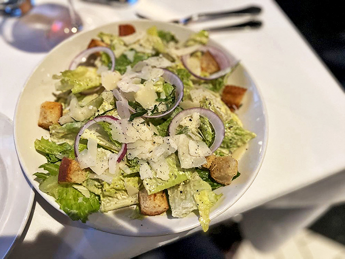 Crisp romaine, sharp red onions, and house-made croutons create the perfect prelude to the main event or a light meal itself.
