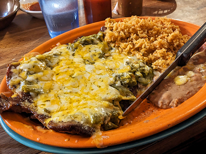 The carne asada doesn't just sit on the plate &ndash; it commands attention with its perfect char, tender texture, and flavor that makes you wonder why you'd ever order anything else.