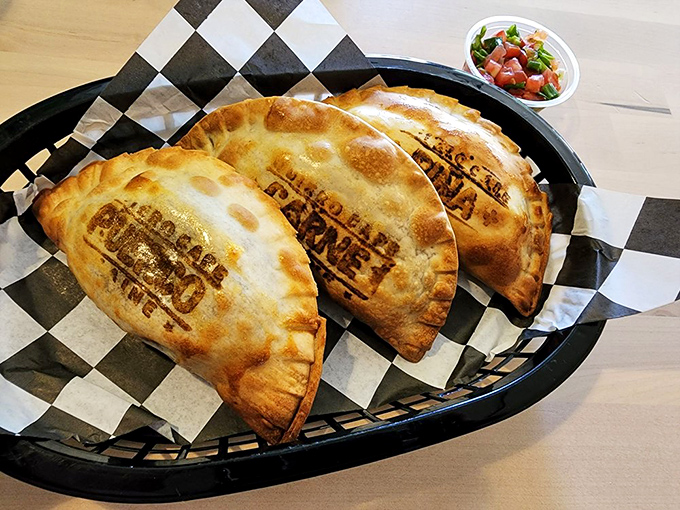 These empanadas wear their "Quiero" brand proudly, like a quality seal promising the perfect ratio of crispy exterior to savory, steaming filling.