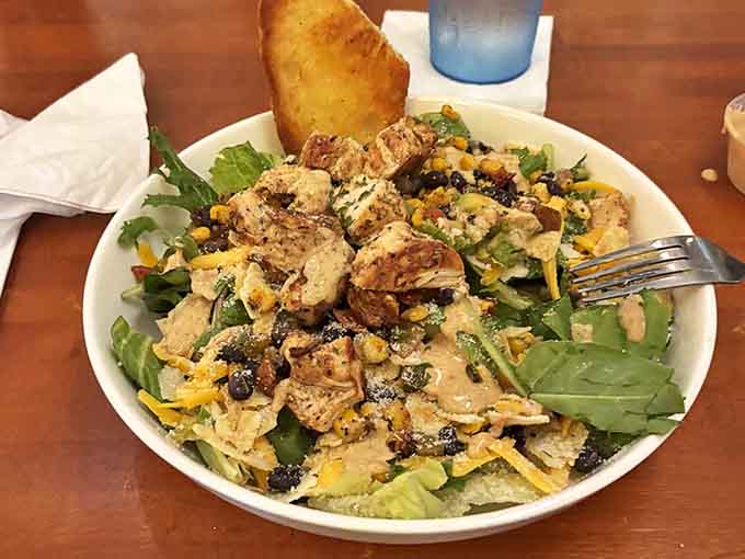 This isn't your sad desk lunch salad &ndash; it's a celebration of textures and flavors, where grilled chicken and fresh vegetables find harmony.
