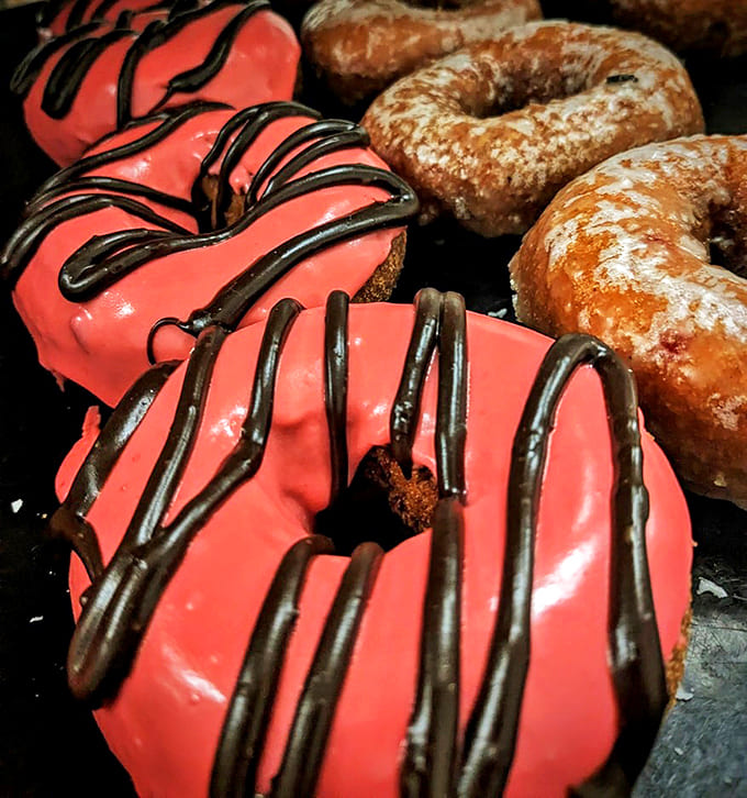 These cherry chip donuts don't just catch your eye &ndash; they practically shout "Eat me!" from behind the display glass.